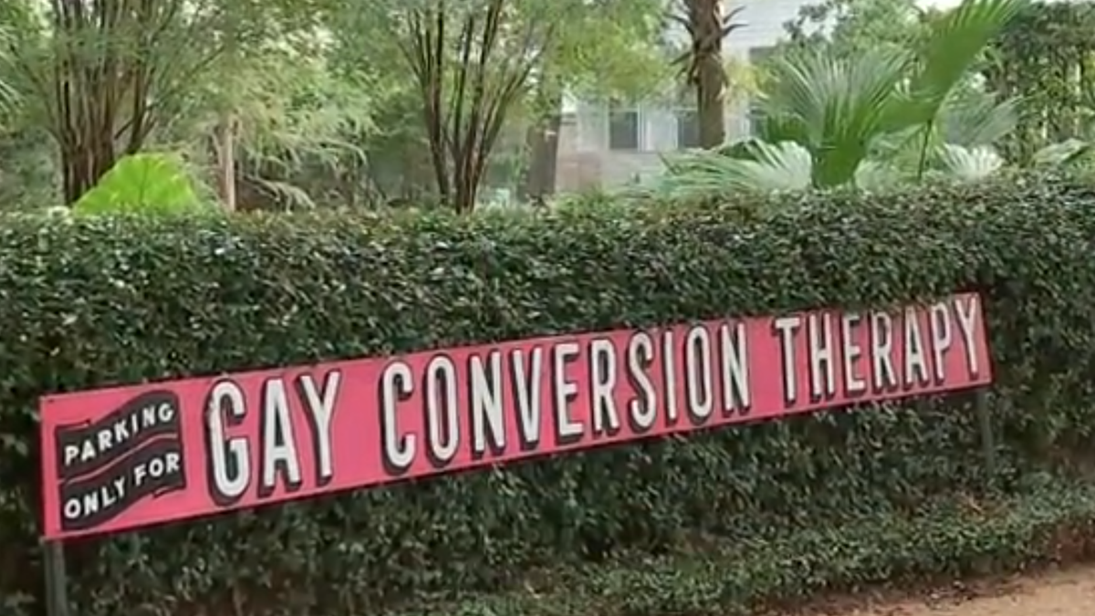 'We're trying humor': Art gallery owner erects 'gay conversion' sign to ...