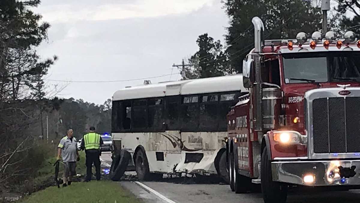 22 sent to hospital after crash between bus, car