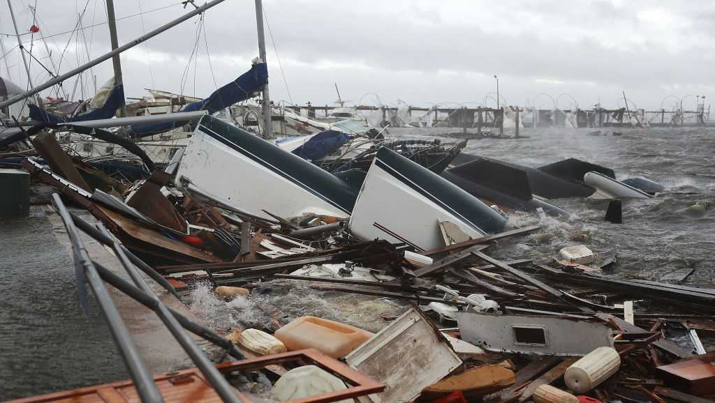 Roofs ripped apart, neighborhoods submerged and flying debris ...