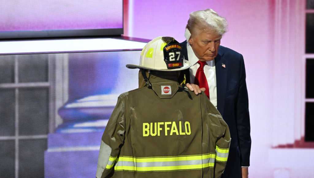 Trump makes entrance to RNC speech with fire gear of rally shooting victim