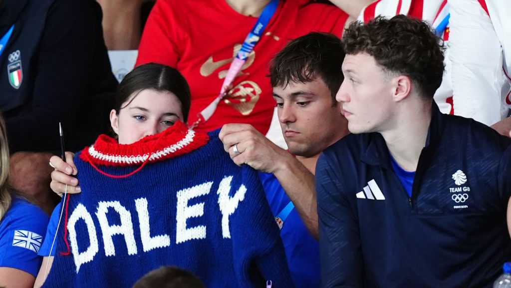 Tom Daley shows off knitting skills while cheering on teammates