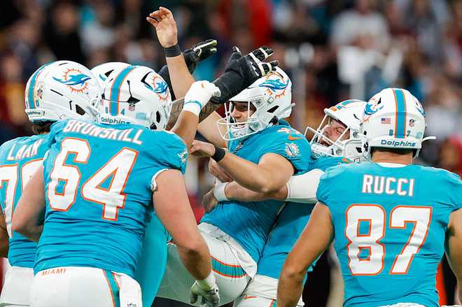 Dolphins beat Commanders in overtime in first NFL regular-season game ...