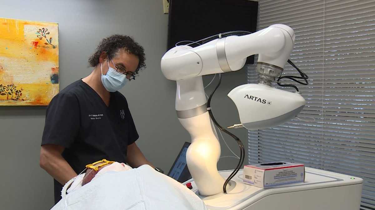 Robot helping with hair transplant procedures