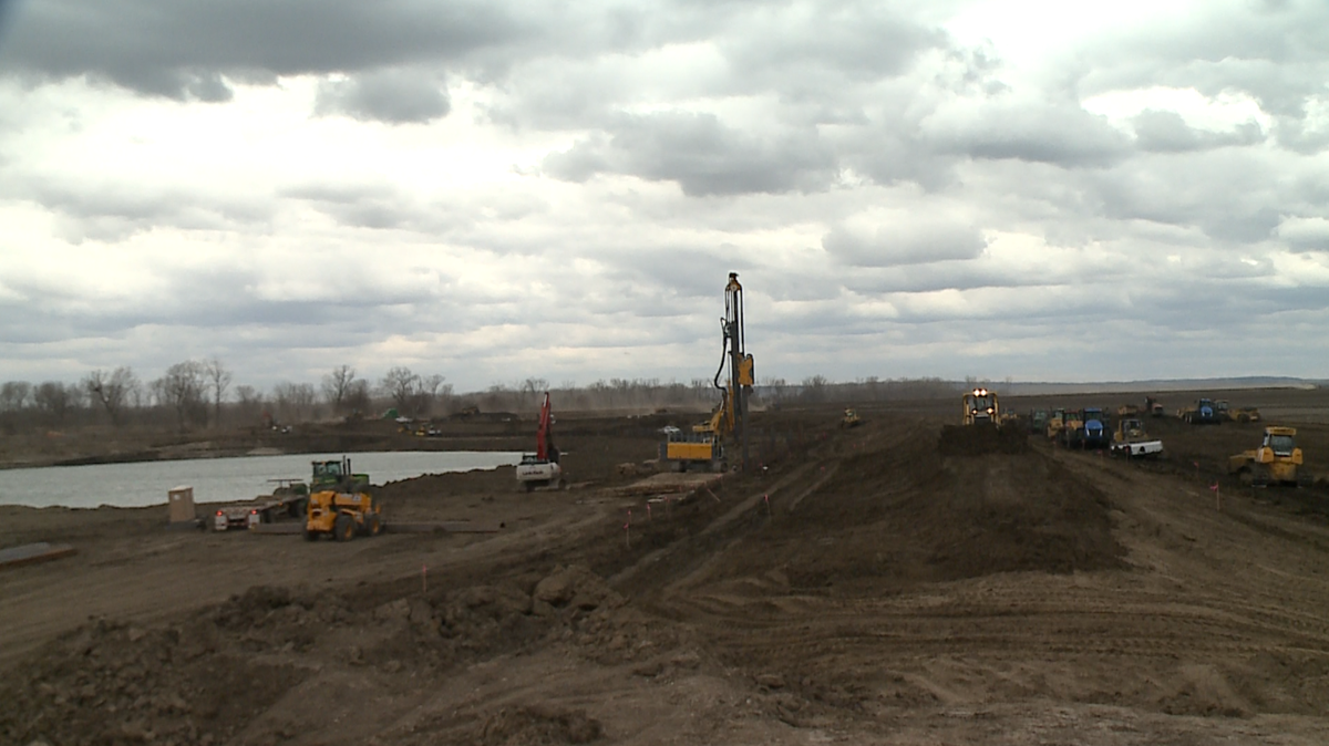 Crews cross milestone in closing damaged levee near Hamburg, Iowa