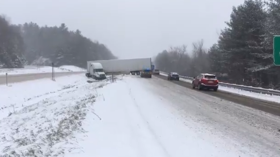 Snow causes multiple tractor trailers to crash