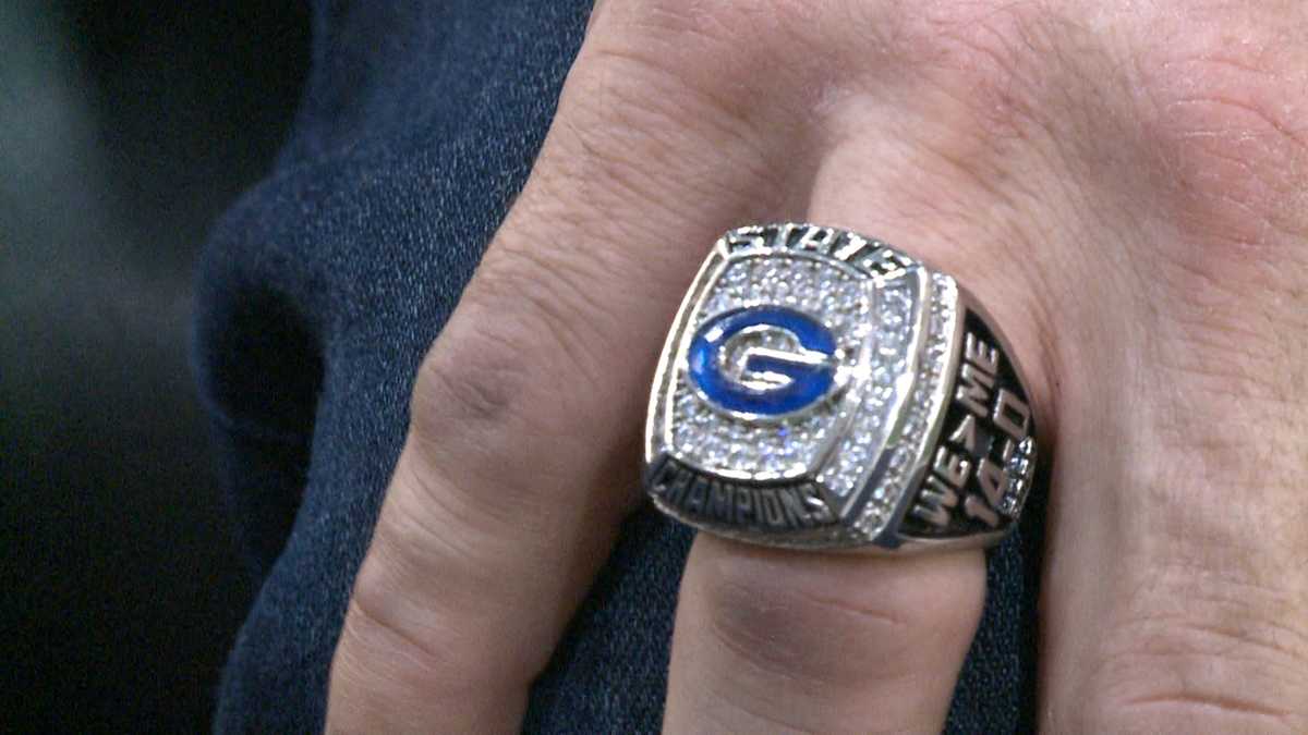 Greenwood football team honors janitor with state title ring