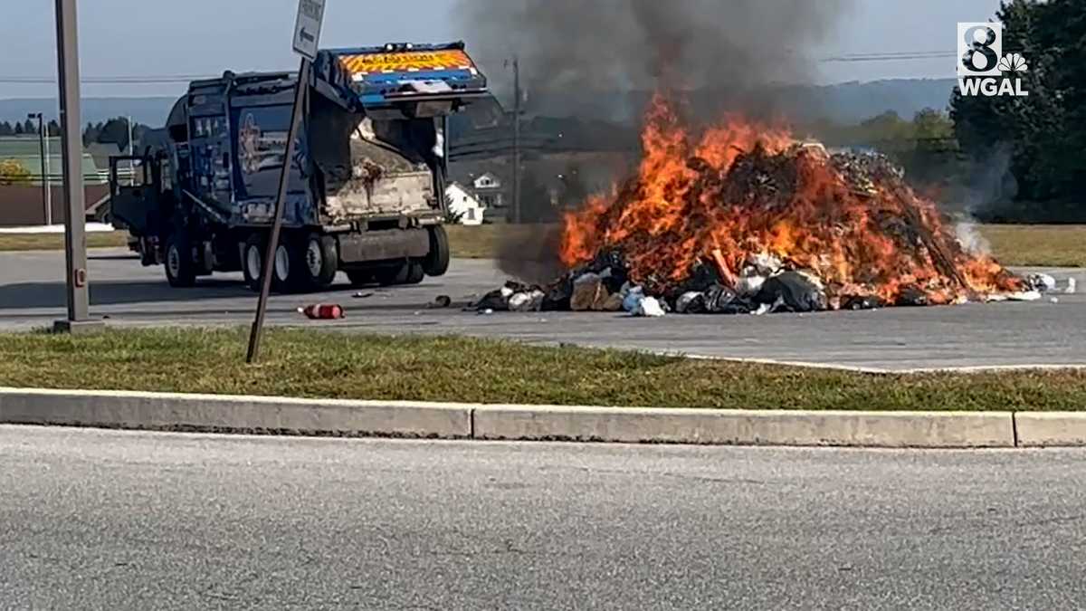 Garbage truck dumps load of burning trash in Hershey parking lot