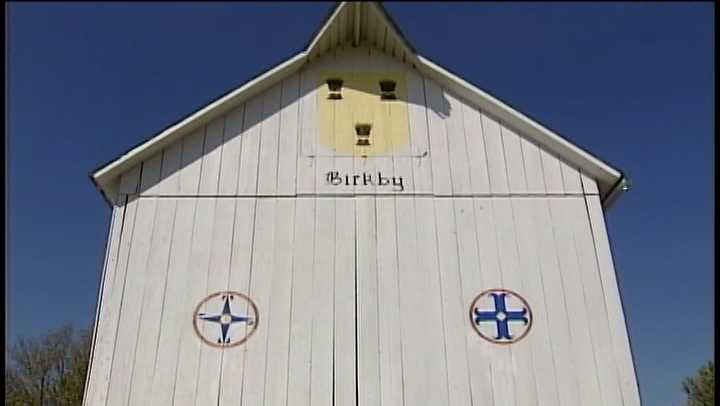 Iowa man paints hexes on barn to ward off witches and weeds