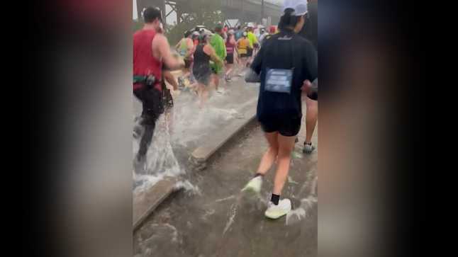 Video shows runners pushing through high water during Flying Pig Marathon
