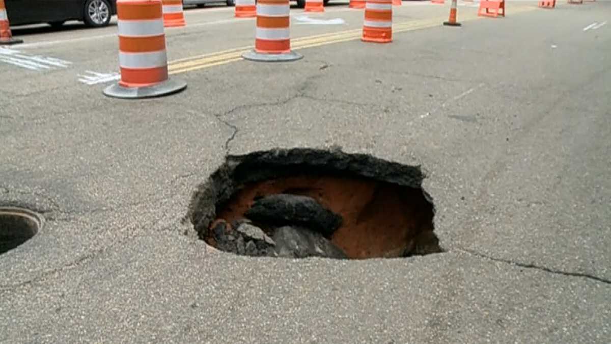 Sewer cave-in causes hole at busy intersection