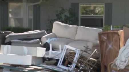 Orange County families clean up debris from damaged homes