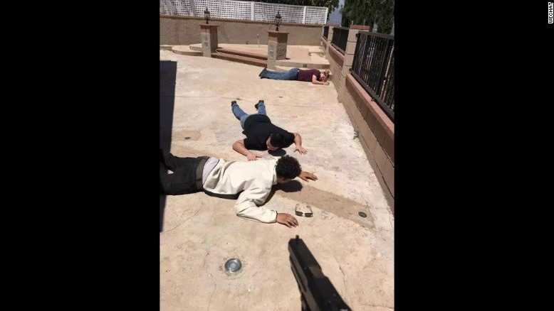 When burglars tried to break in, he grabbed his gun -- and snapped a pic