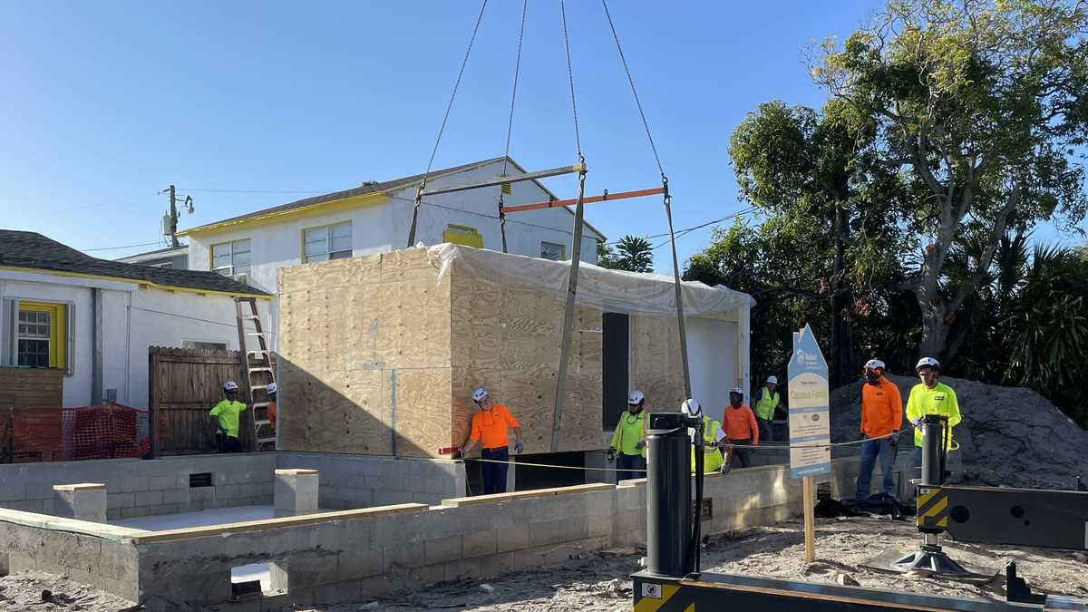 Florida students watch home they built for family placed onto foundation