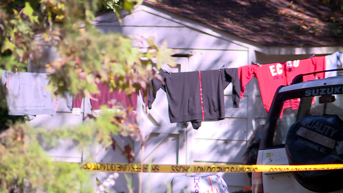 Law Enforcement Investigating A Quintuple Homicide