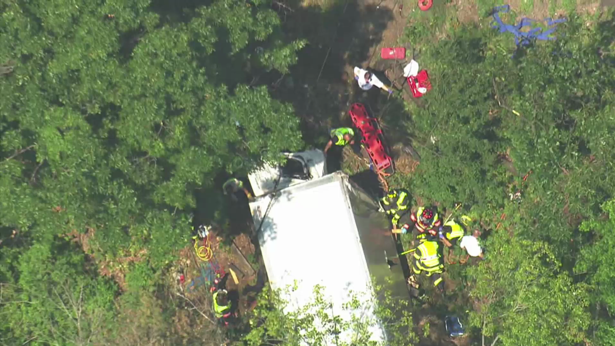 Driver of box truck ejected, trapped under truck after I-495 crash