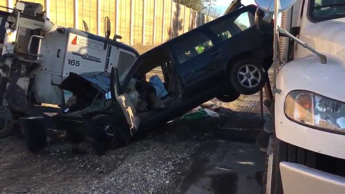 Car crashes through barrels, hits street sweeper on I-93 in Manchester