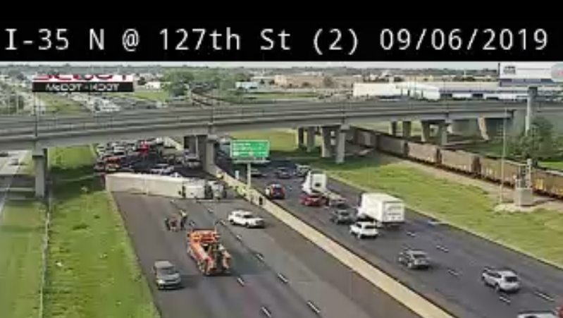 Overturned semi blocking all lanes of northbound I-35 at 127th