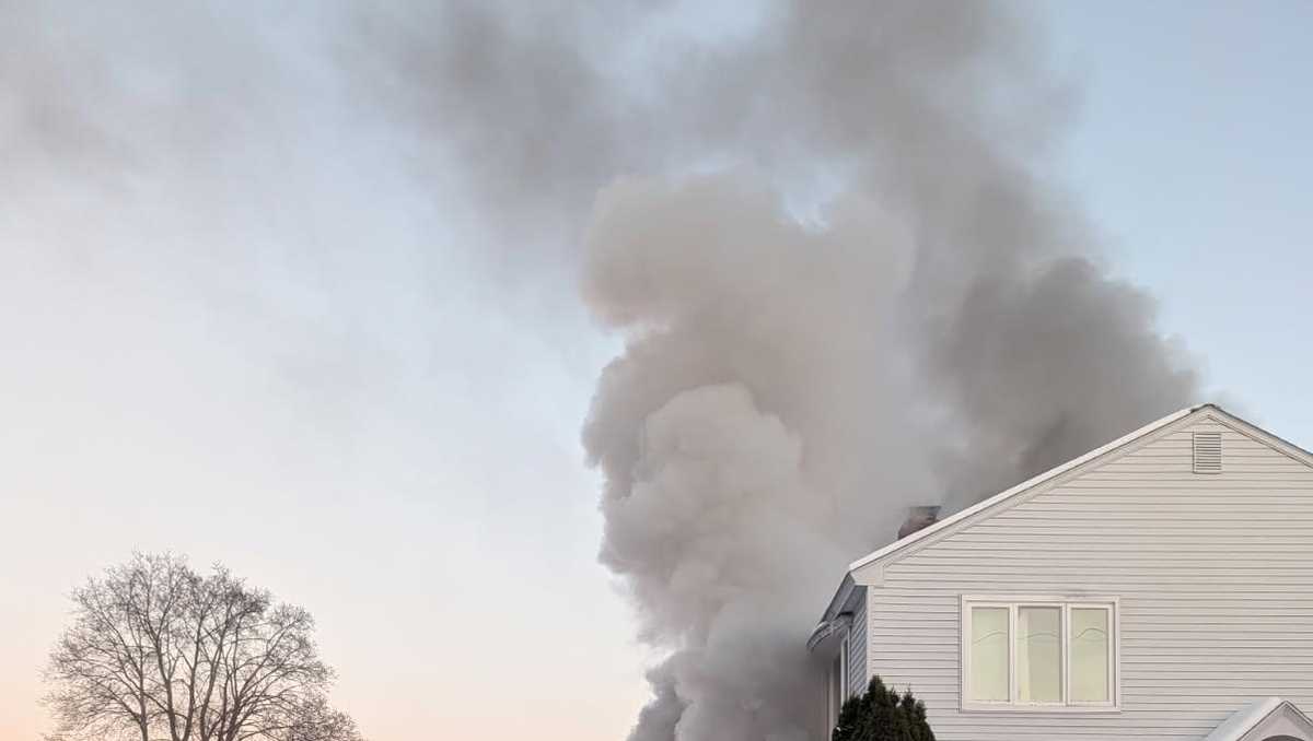 Woman taken to hospital after fire in Manchester