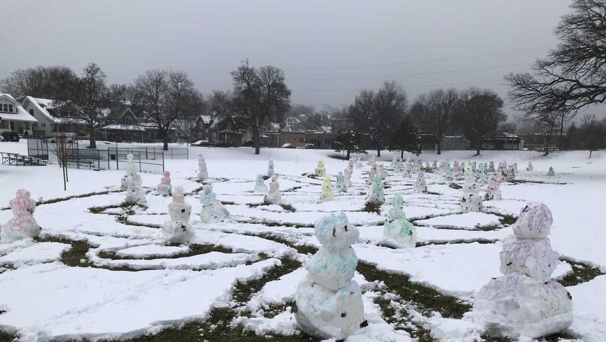 100 multicolored snow people created by UNO student