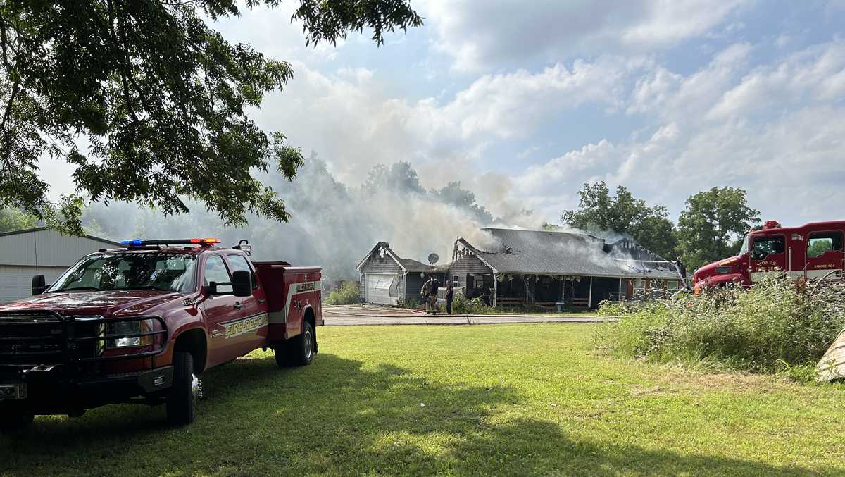 Multiple agencies battle house fire in Jones