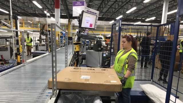 Amazon shows off massive, new warehouse on South Coast