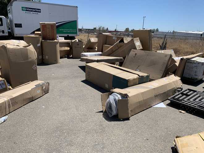 California Shipping Delay: Pile of UPS packages left in parking lot for ...