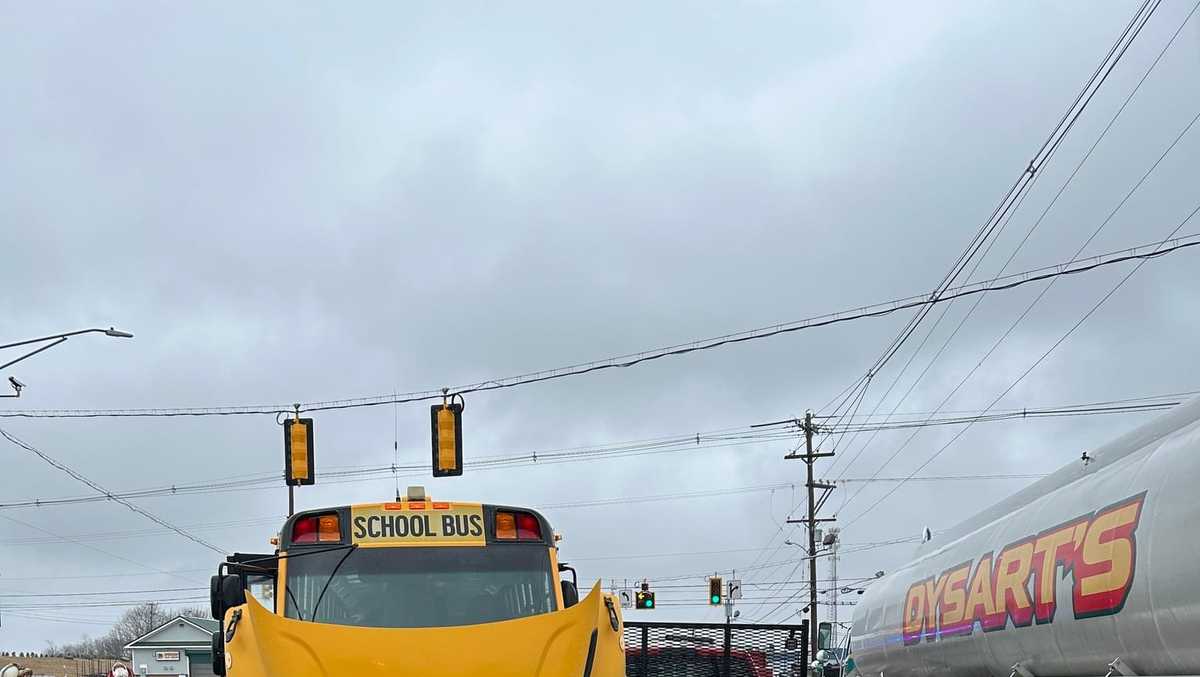 One person hurt when school bus, fuel truck and truck collide