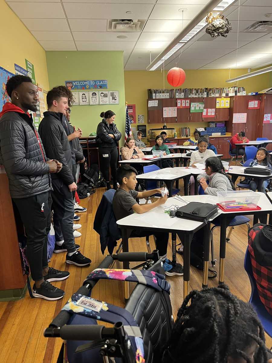 PHOTOS: UC football players spend time with students at Hartwell Elementary