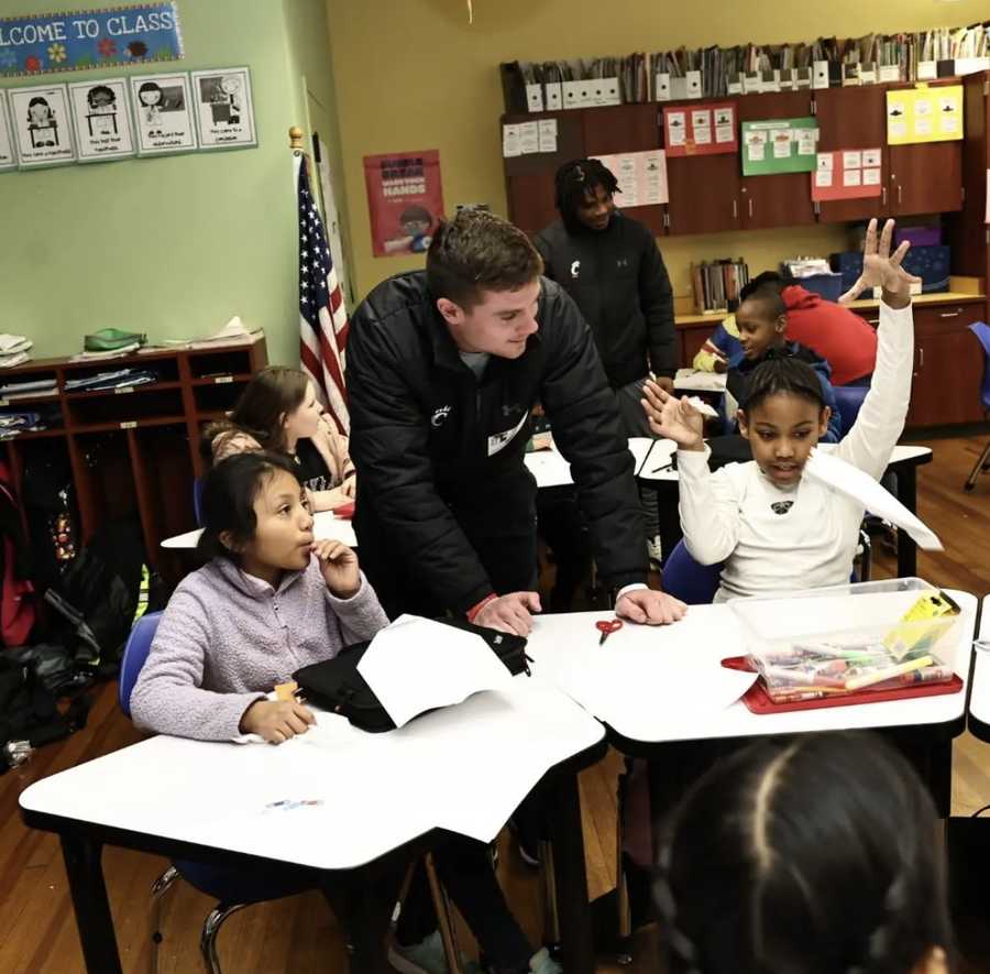 PHOTOS: UC football players spend time with students at Hartwell Elementary