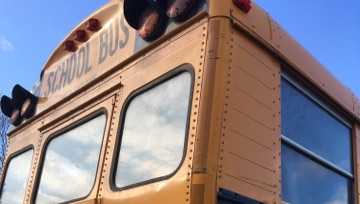 Hudson school bus crashes into building, police say