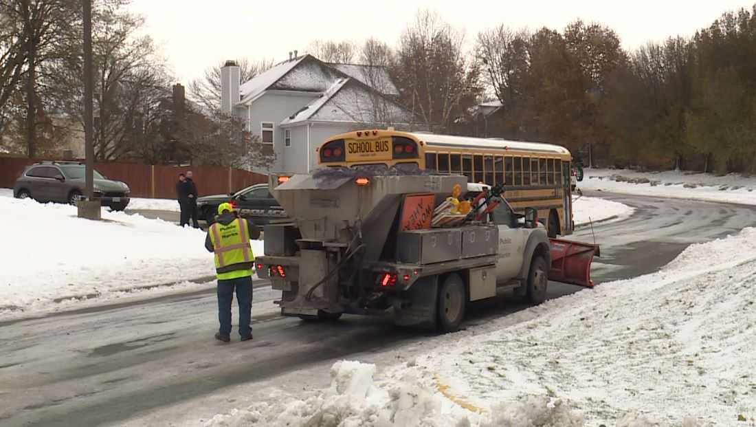 Van, car hit school bus stuck on icy street in Independence