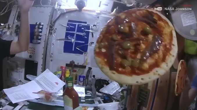 Astronauts enjoy zero-gravity pizza party aboard space station