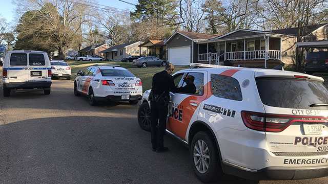 Man, child hurt by flying glass when neighbor opens fire, JPD says