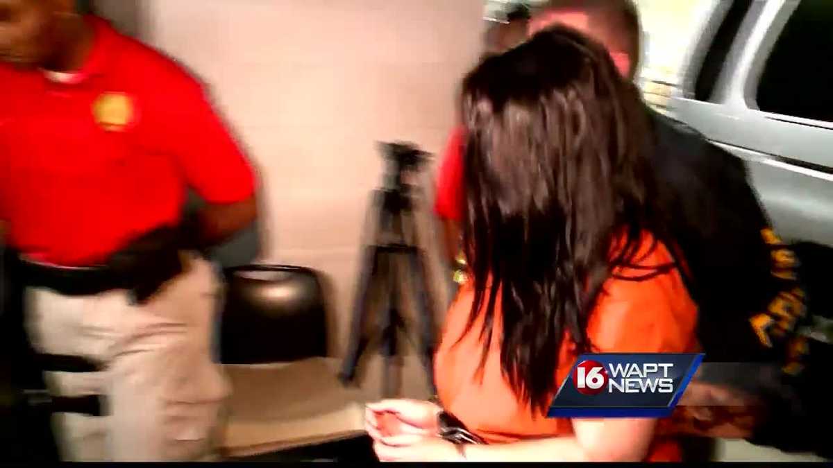 Woman accused in pawn shop triple murder pleads not guilty