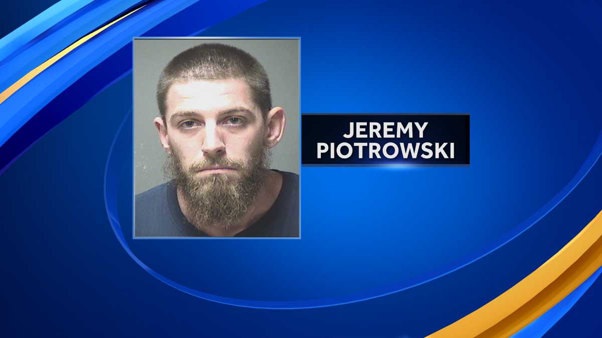 Man charged after found looking into woman's window