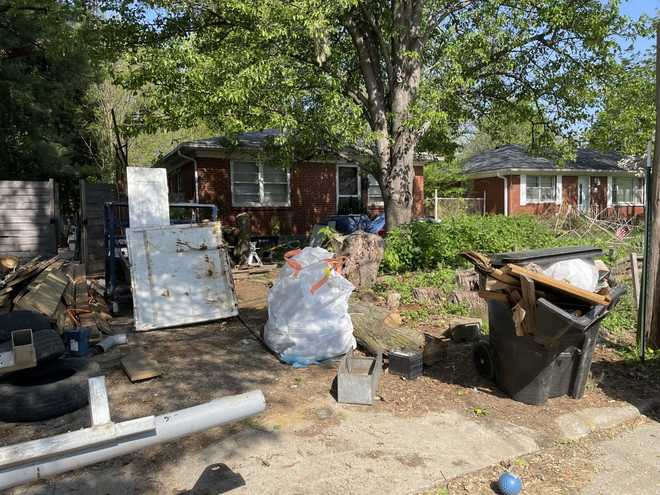 Shawnee homeowner owes city thousands for 'junk' outside properties