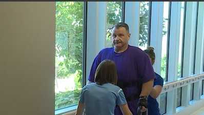 Paralyzed officer works to walk again