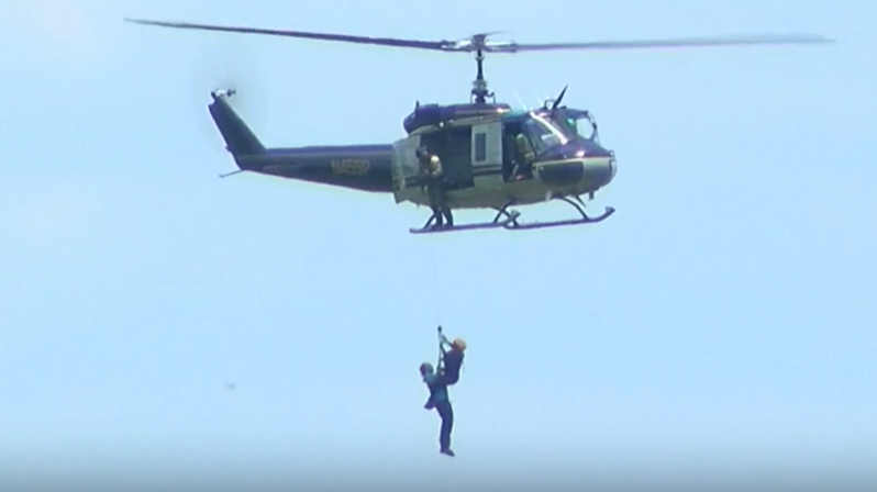 Dramatic video shows challenging rescue of 2 kayakers trapped on ...