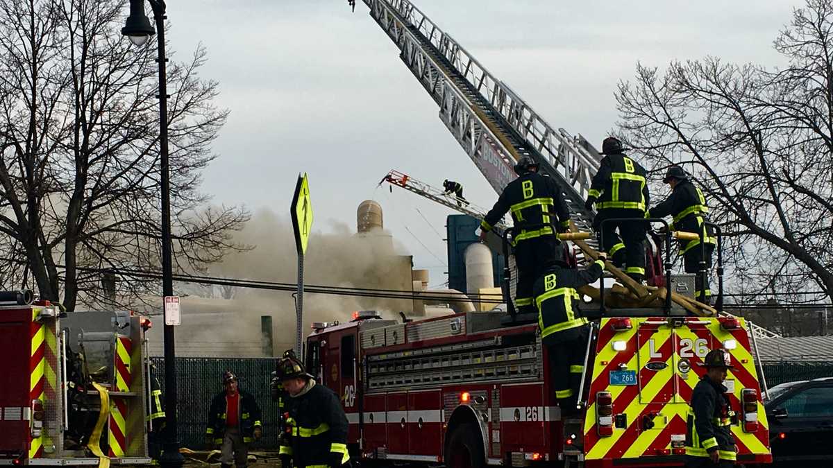 Raging fire at East Boston business prompts evacuations, MBTA disruption