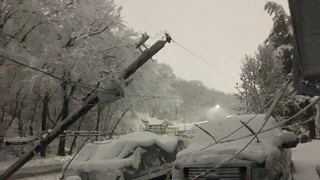 Downed power poles, outages follow Sunday snow