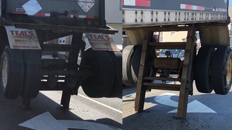 Tractor-trailer malfunction leaves wheels hanging in mid-air