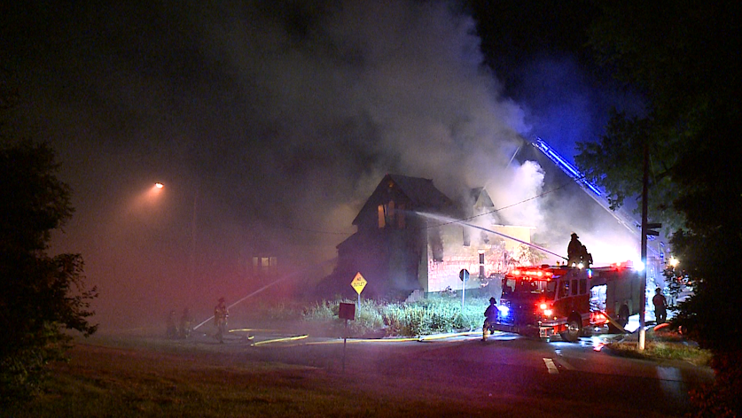 Dozens of firefighters, ladder truck called in to battle house fire