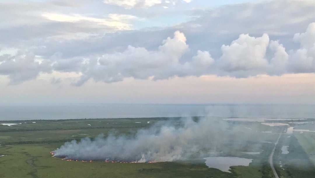 30-acre marsh fire raging at Bayou Sauvage