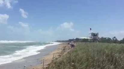 Lifeguards monitor sea conditions, talk with beachgoers about potential ...