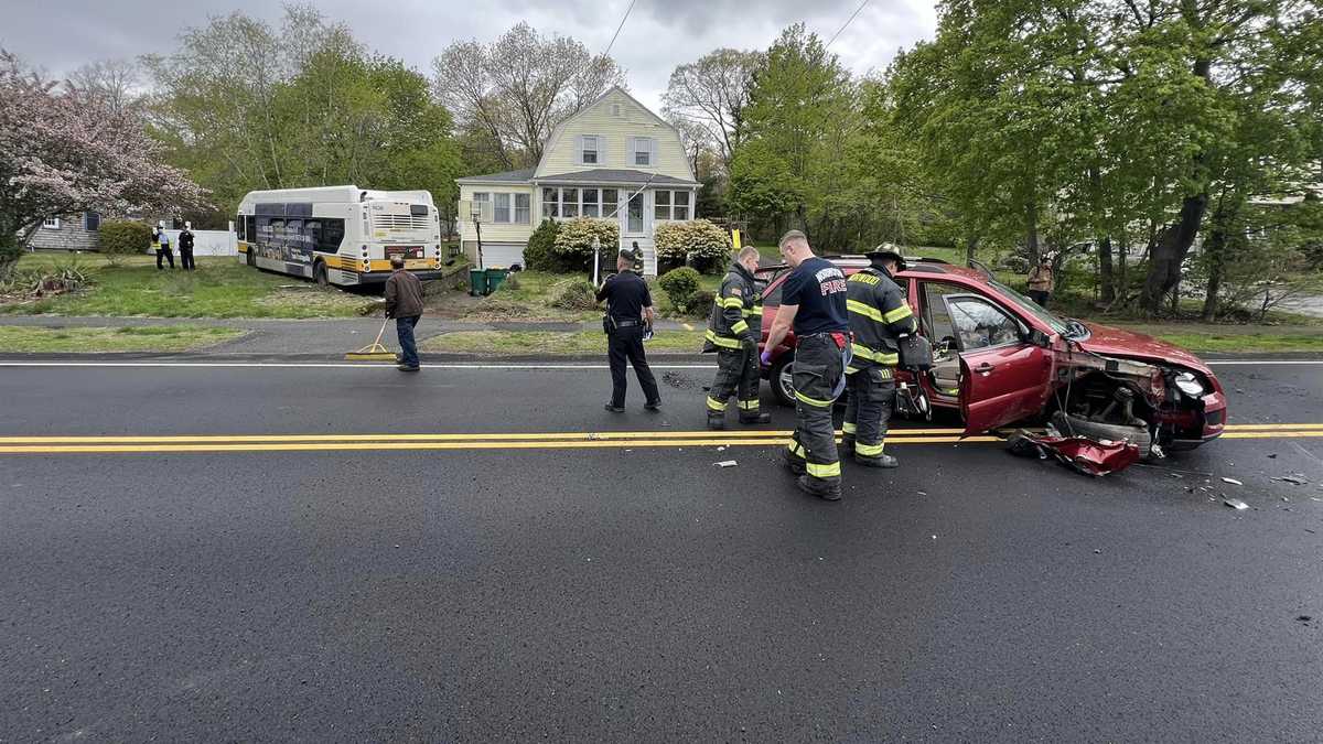 MBTA bus winds up on front lawn of Norwood home after car crash