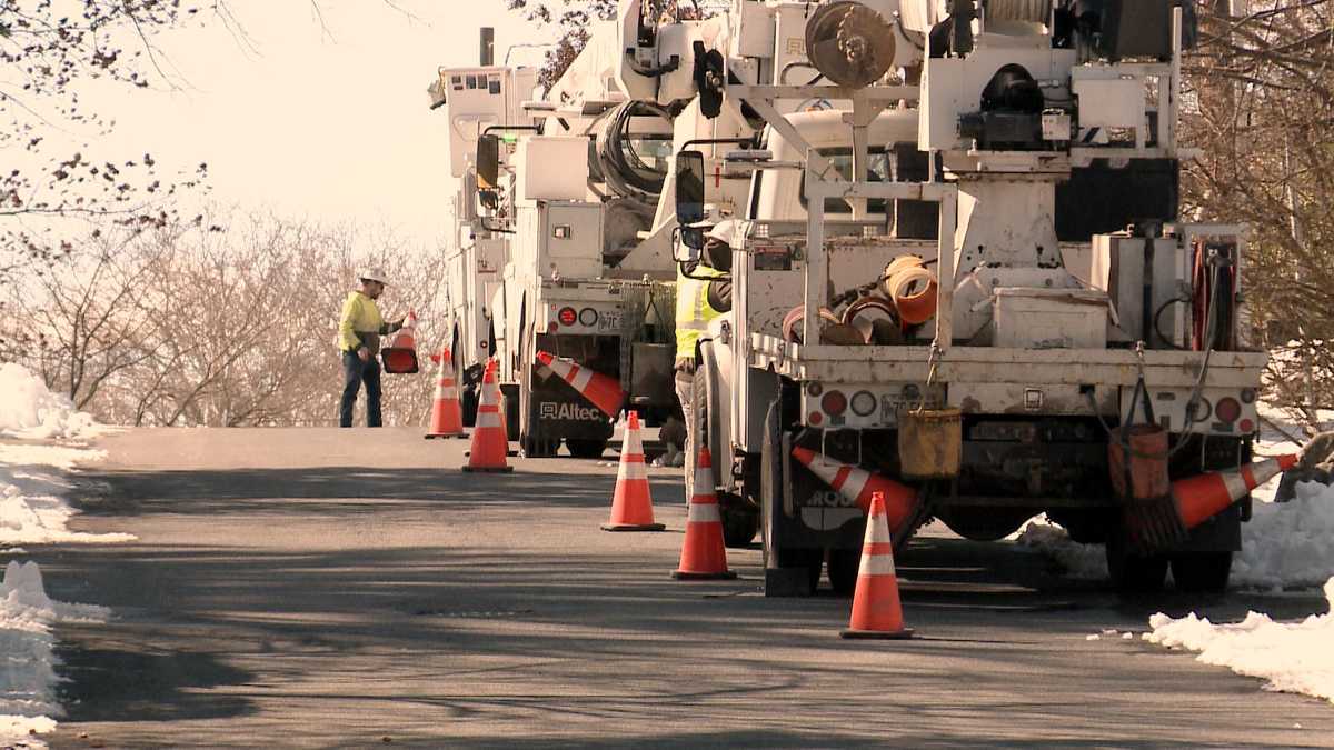 Many remain in dark after power outages following snow storm