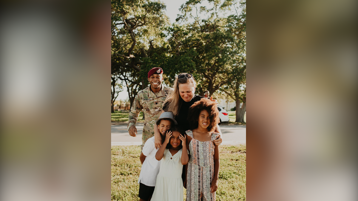 Photographer captures epic photo-bomb military reunion