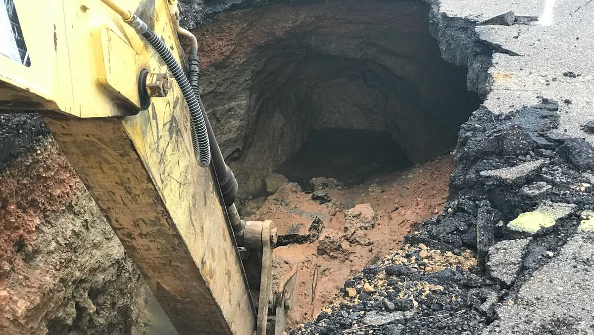 Sewer cave-in opens hole in busy intersection