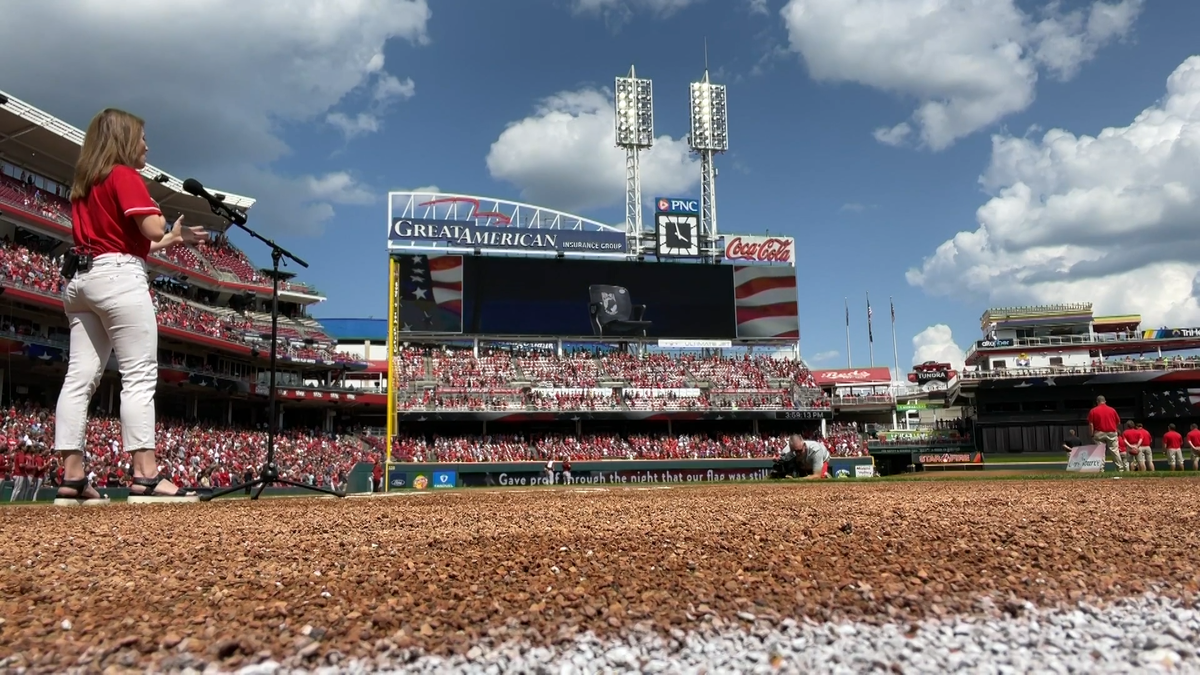 WLWT's Meredith Stutz sings national anthem before Reds game