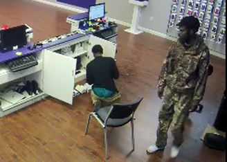 Images released of armed robbers who they say tied up, robbed cellphone ...